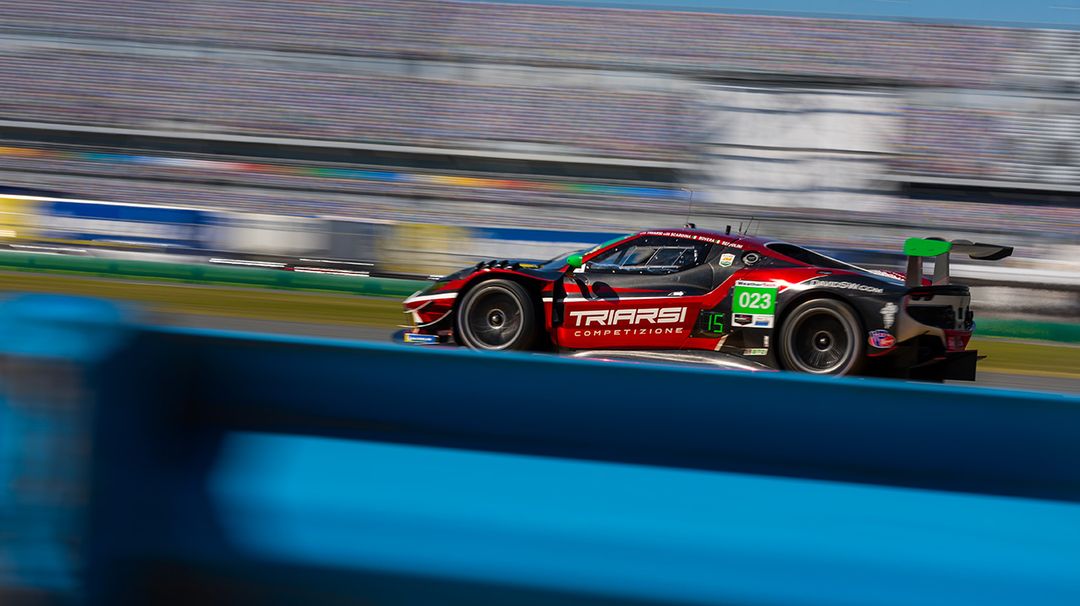 Two Ferraris racing at Daytona after 20 hours